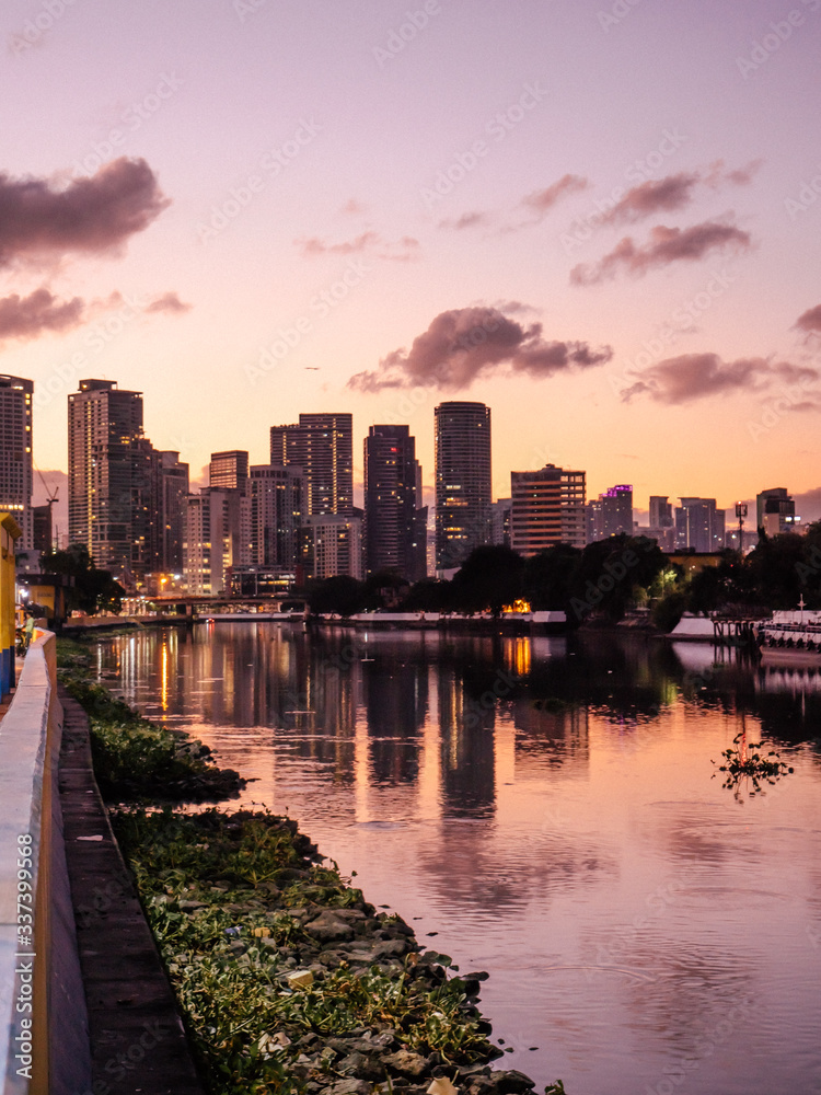 Skyline of Makati City reflecting in the Pasig River in Metro Manila ...