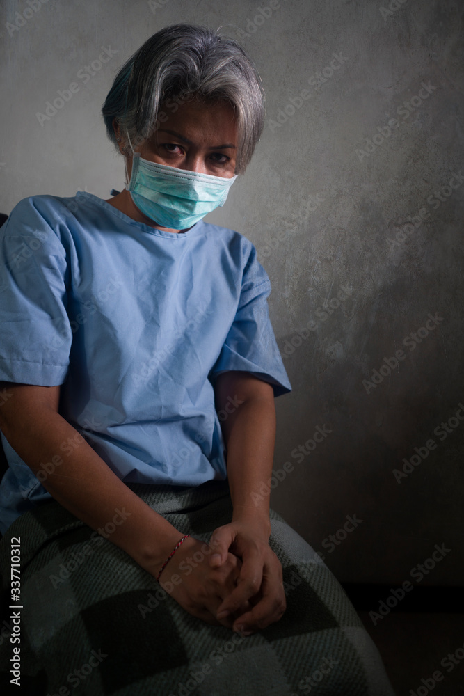 covid-19 virus spreading disease - scared and sad mature woman with ...