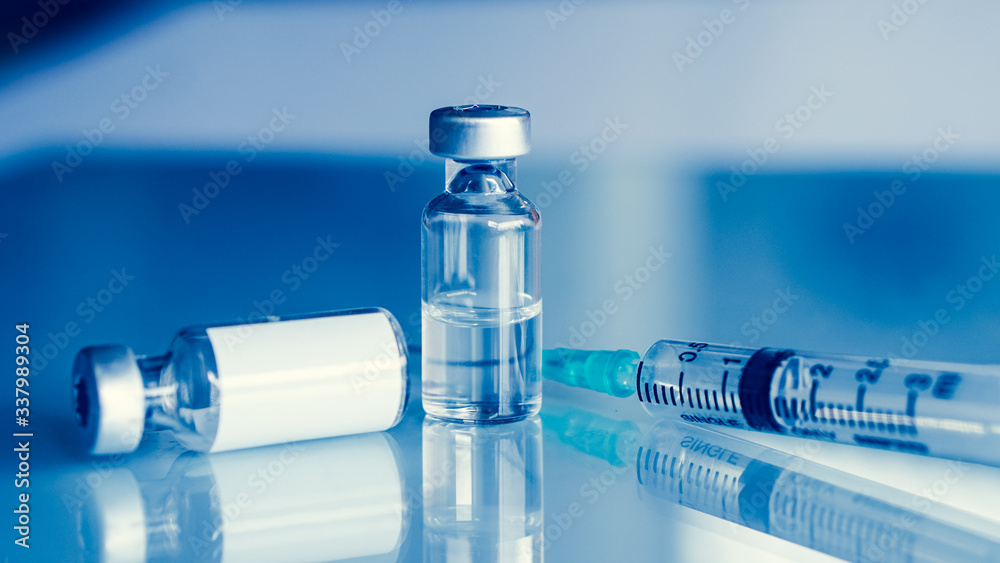 Vaccine vial dose flu shot drug needle syringe,medical concept . blue ...