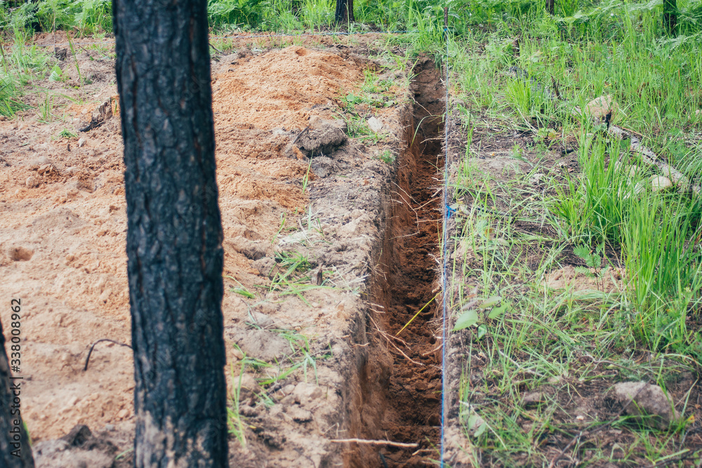 Deep trench in the ground for pouring concrete - strip foundation ...