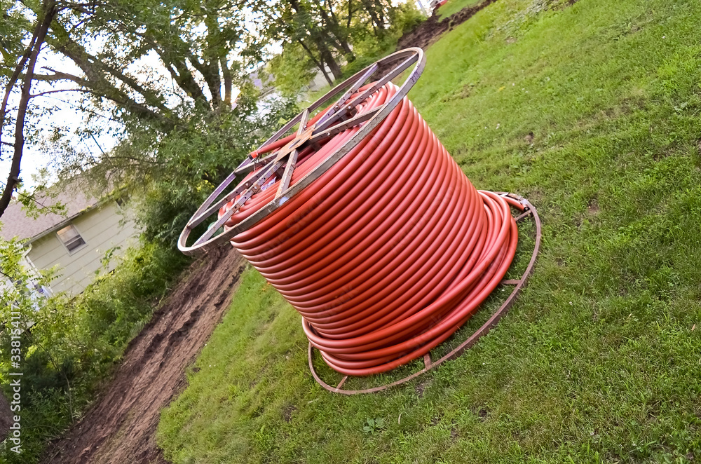Spool of Cable Sitting in a Backyard Stock Photo | Adobe Stock