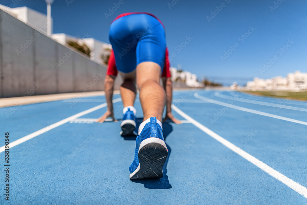 Sprinter at starting line waiting to start run race competition at ...