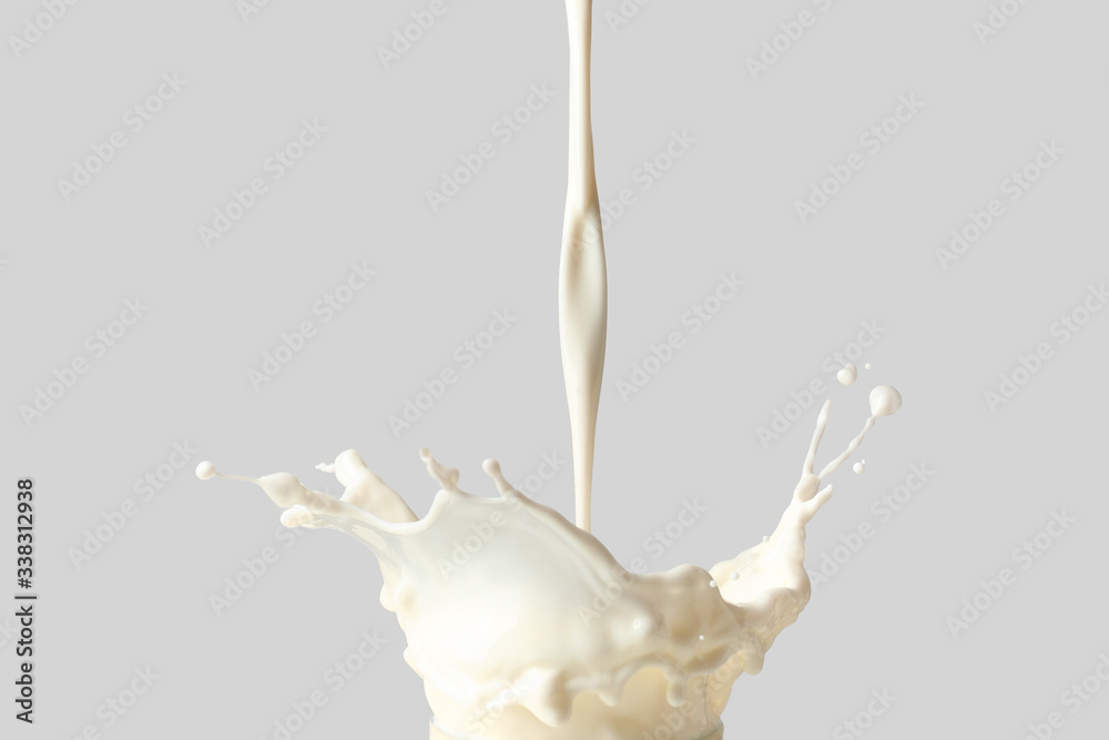 Splash of milk on light background Stock Photo | Adobe Stock