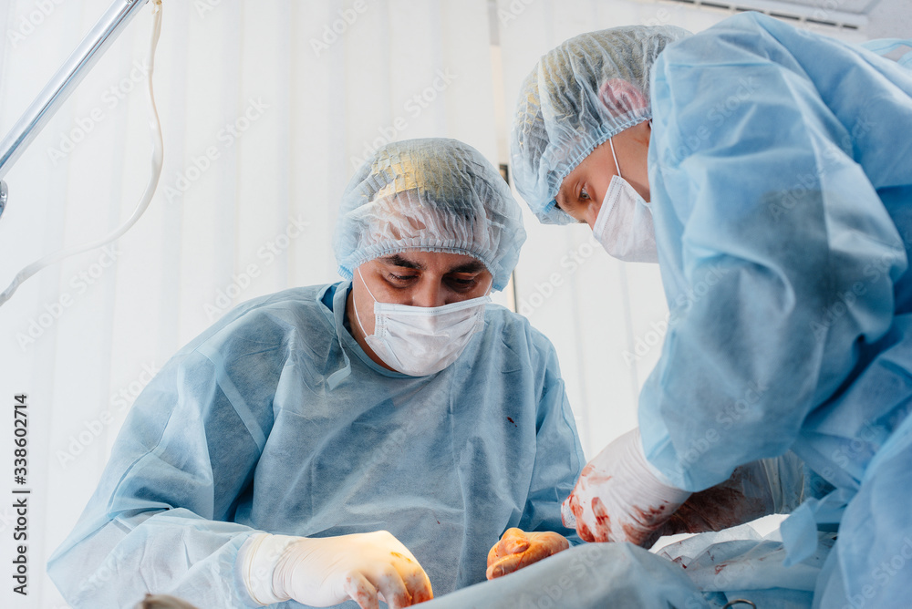 Operation in a modern operating room close-up, emergency rescue and ...