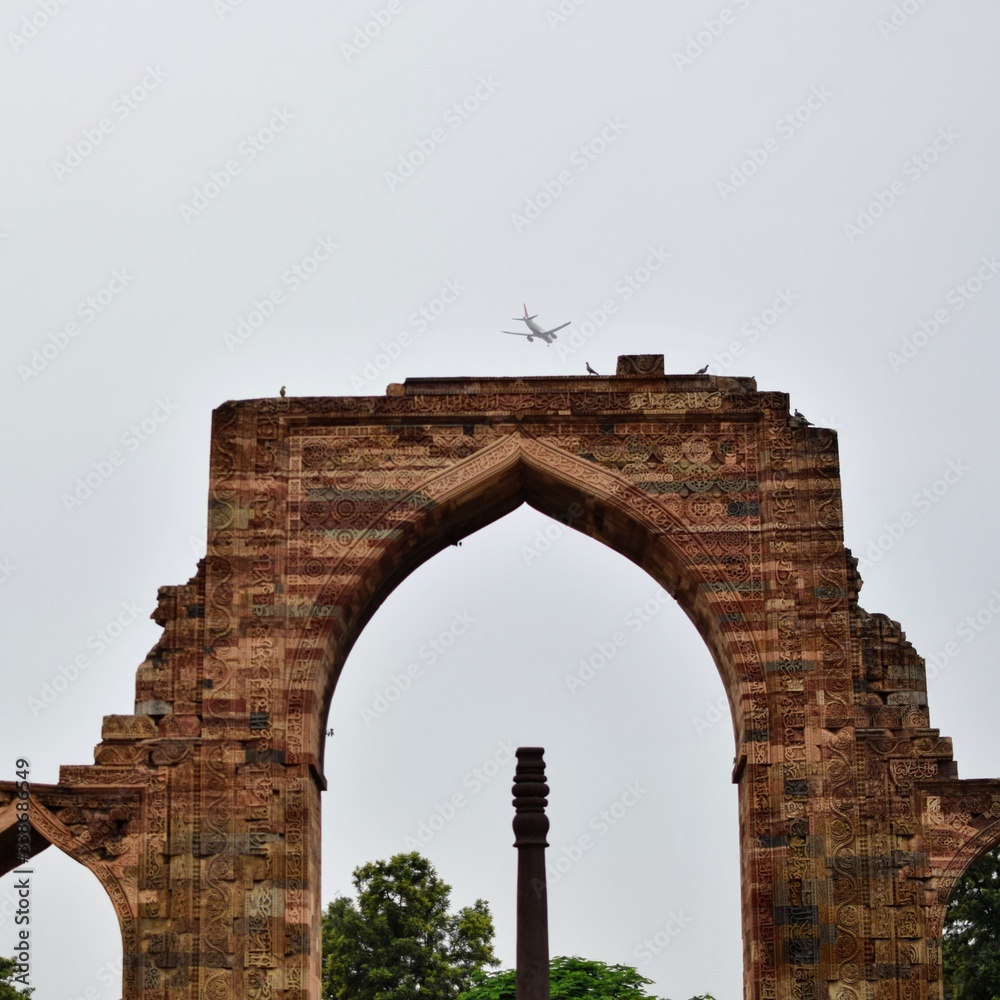 Inside the Qutub Minar Complex with antic ruins and inner square ...