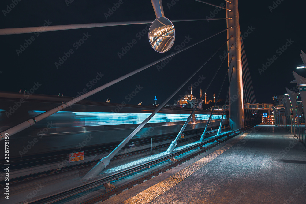 Istanbul modern looking metro train line long exposure and platfrom ...