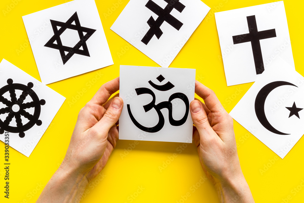 Choose religion concept. Hands with Buddhist Om sign near world ...