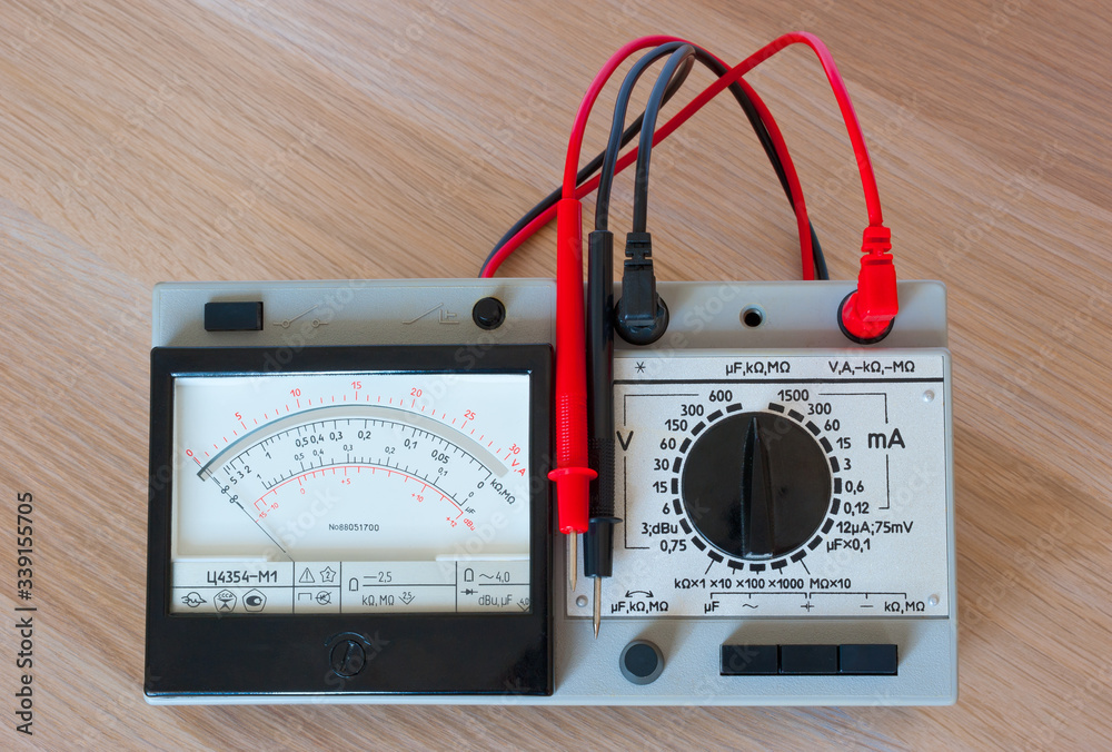 Analog multimeter with two-color wires. Stock Photo | Adobe Stock
