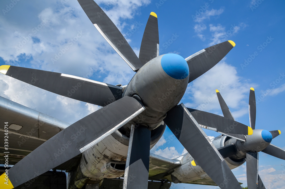 Two big airplane propeller blade of engine on one side of the plane and ...