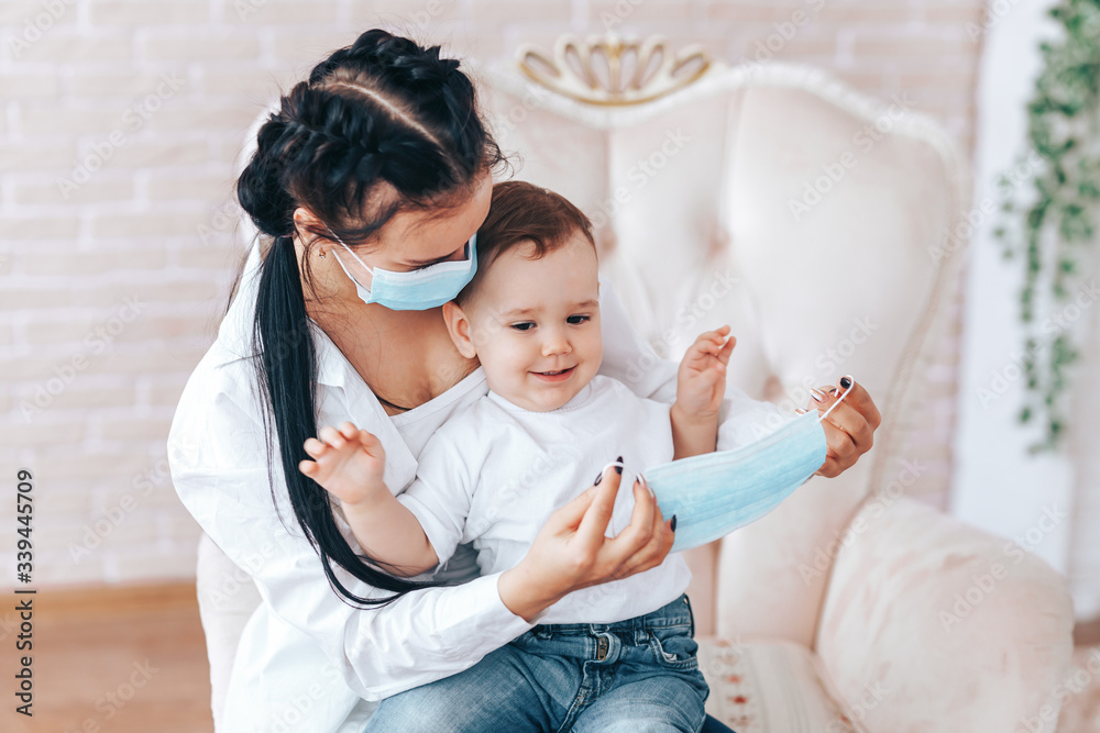 Mom with son in masks, mom puts mask on the child, how to protect ...