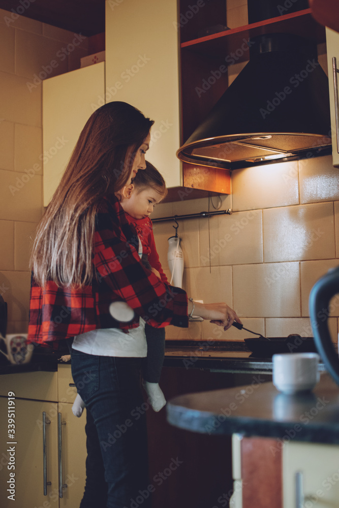Housework with little kids. Household chores for children. Young woman ...
