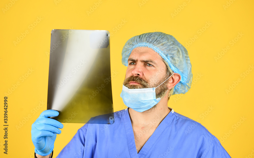 surgeon doctor examines radiographical snapshot. x-raying of vertebra ...