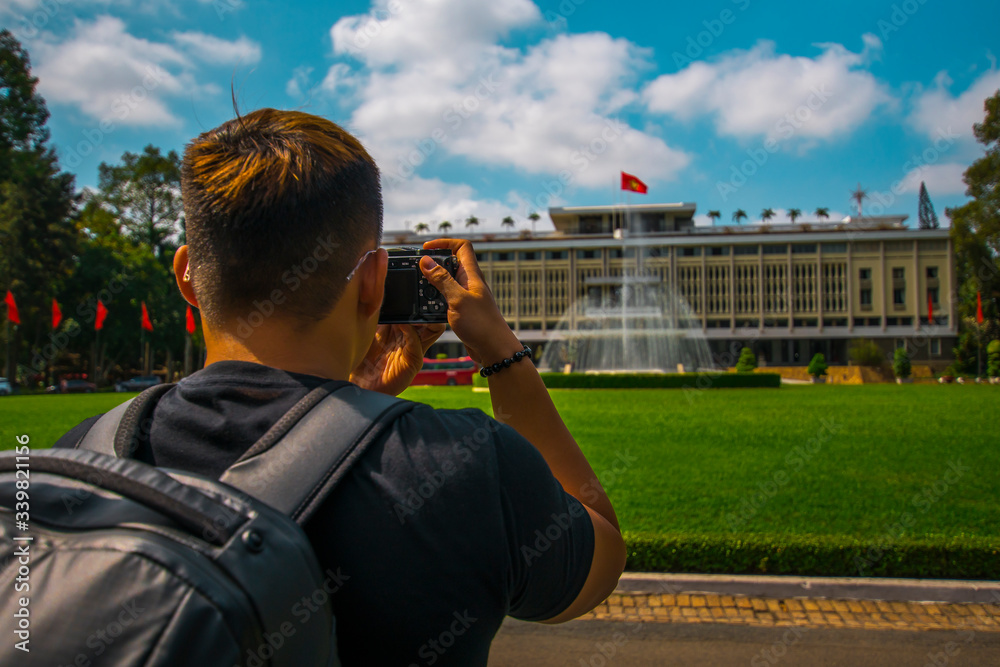 Back side of Young Asian traveling men taking a photo of Independence ...