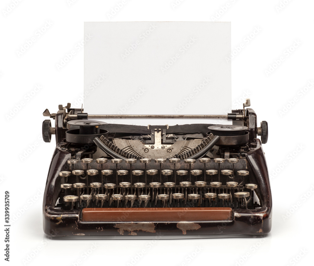 Old vintage typewriter and a blank sheet of paper inserted. Isolated on ...