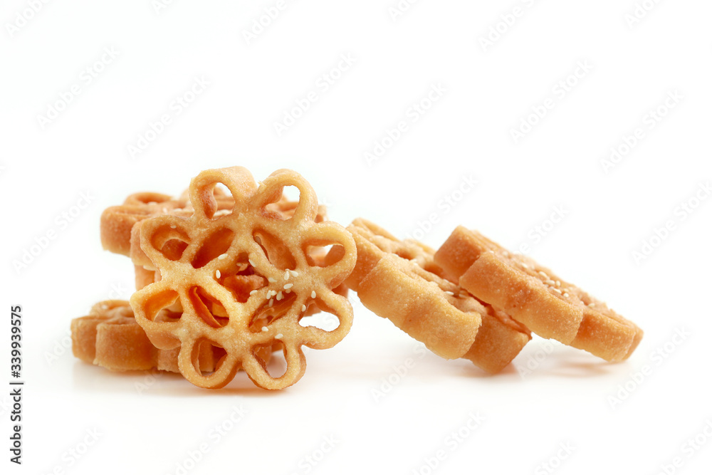 Honeycomb cookies also known as Kuih Loyang on white background. This ...