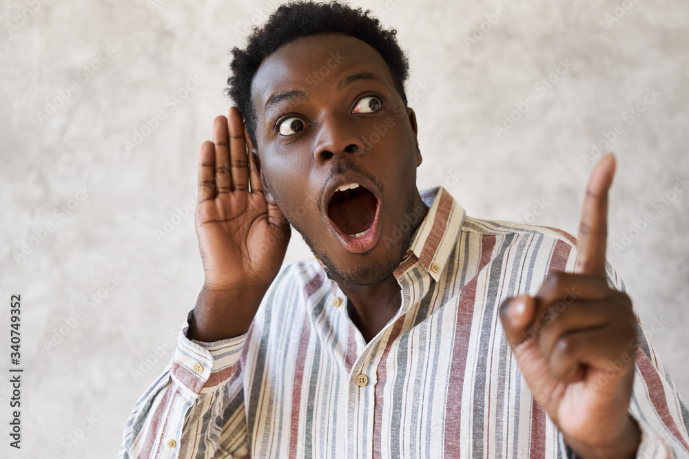 Photo Stock Oh my God! Funny bug eyed surprised young dark skinned male ...
