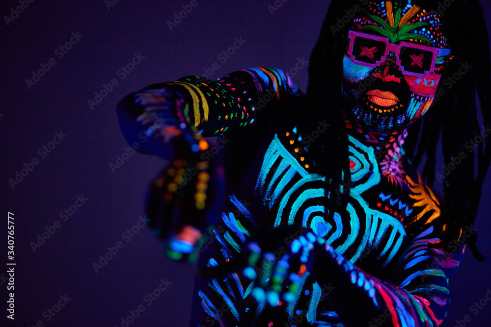 UV body art concept. young cyber raver dance, fluorescent make-up ...