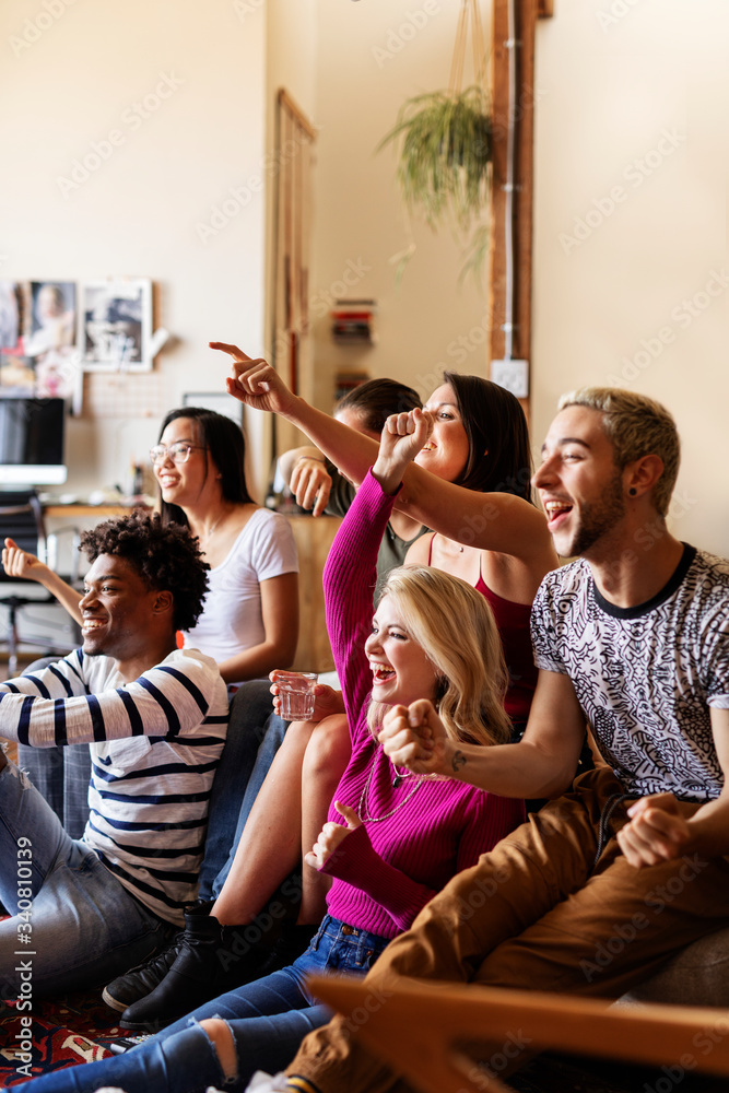 Friends cheering on their team Stock Photo | Adobe Stock