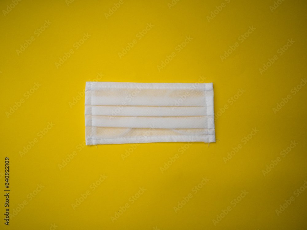 Surgical mask. Typical 3-ply surgical mask to cover the mouth and nose ...