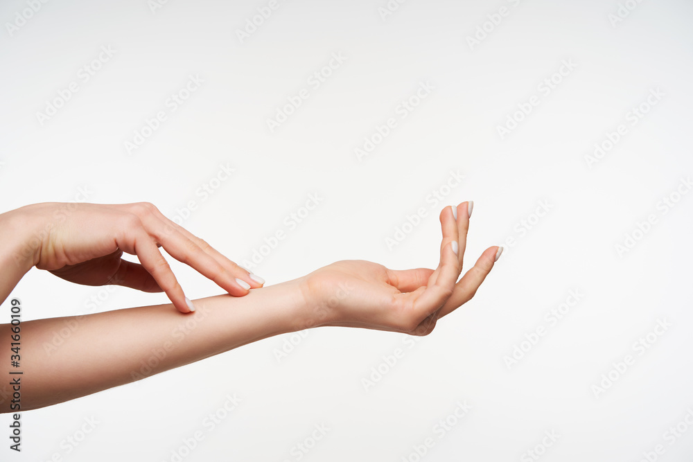 Side view of young elegant raised lady's hands touching each other ...