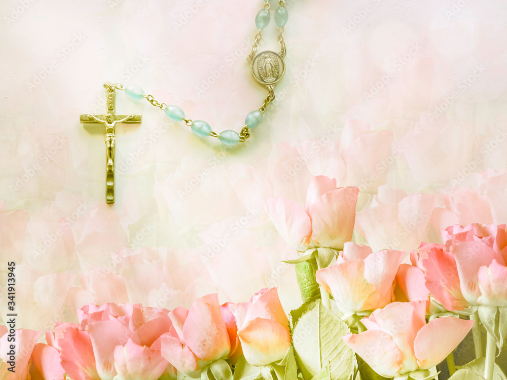 Rosary on a rosy background, group of red roses fading on a background ...