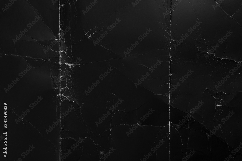 Crumpled black cardboard with wrinkles and wrinkled folds. Old wrapping ...