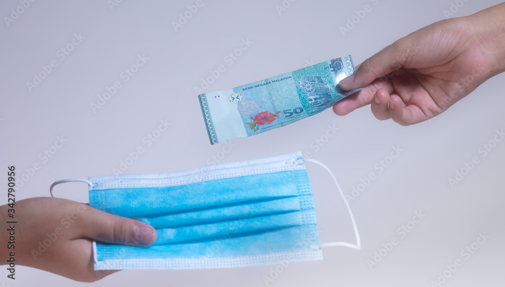 Foto stock di Face masks, the new currency in Malaysia and the world ...