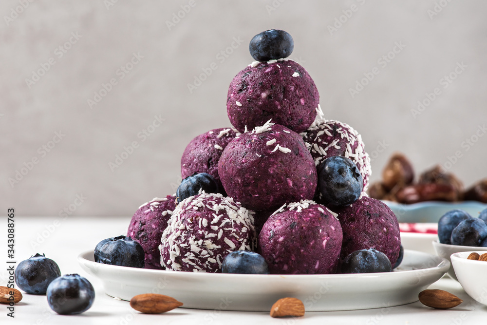No bake blueberry and acai energy bites or balls, prepared with natural ...