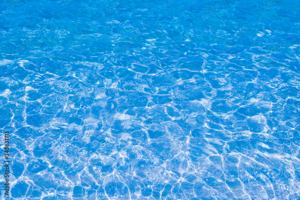 Blue clear water in the pool. Texture of water surface. Overhead view ...