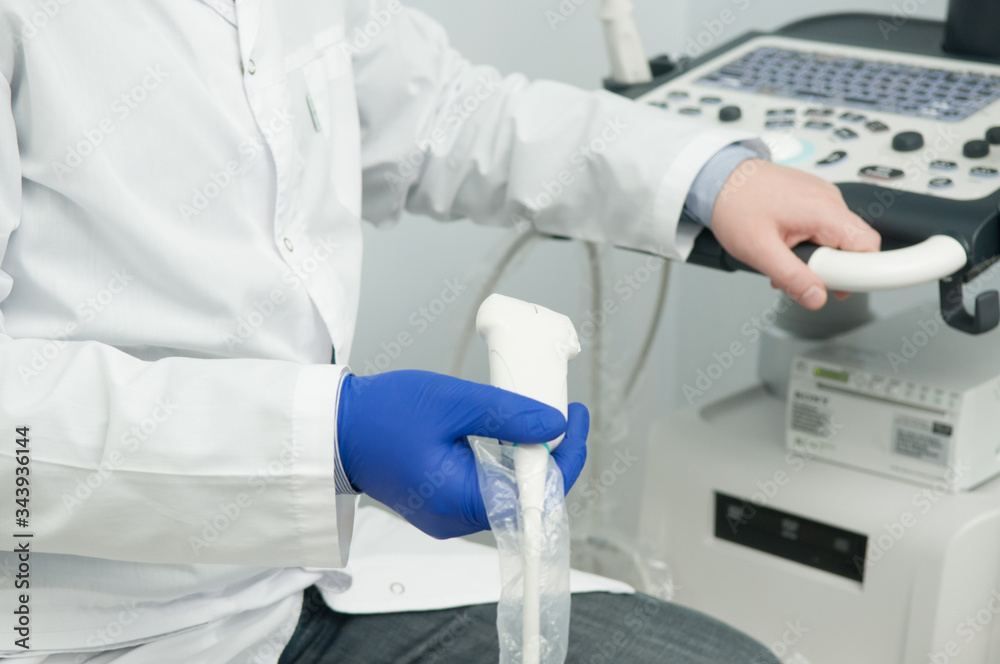 Doctor's hand with ultrasound sensor Stock Photo | Adobe Stock