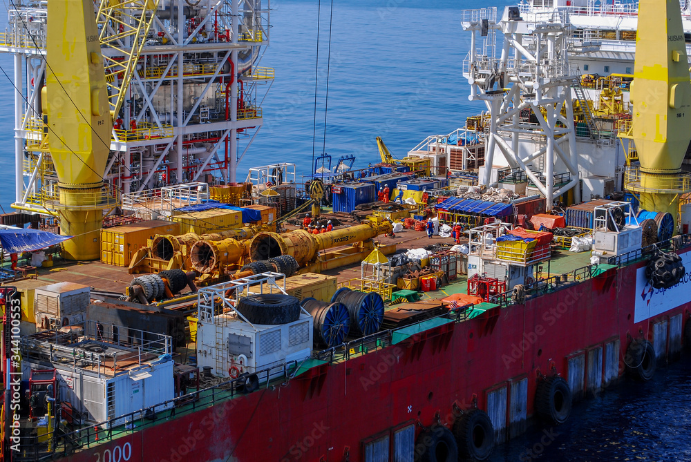 Large work barge carrying new structure module to be installed at oil ...