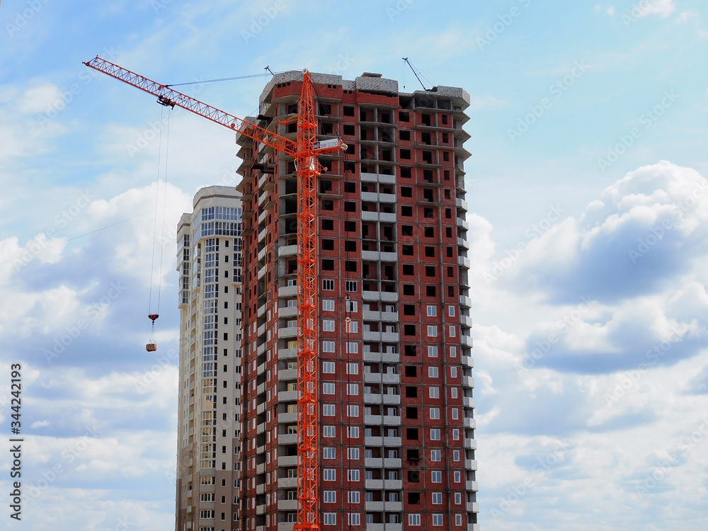 Skyscraper construction. Construction site background. Self-erecting ...