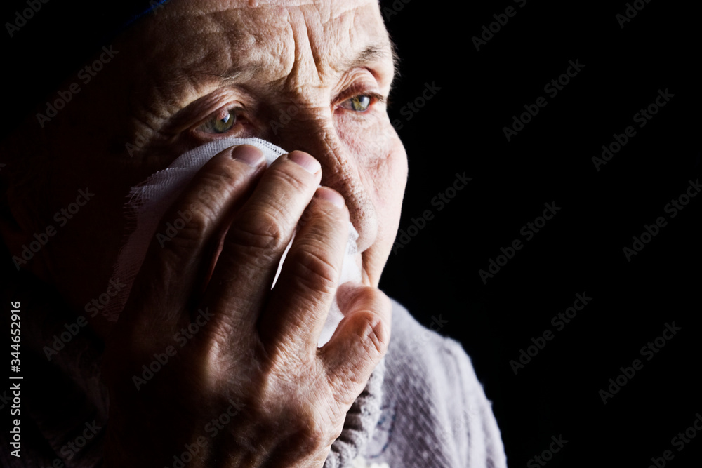 Old grandmother wipes a tear closeup. Crying old woman. Wrinkled face ...