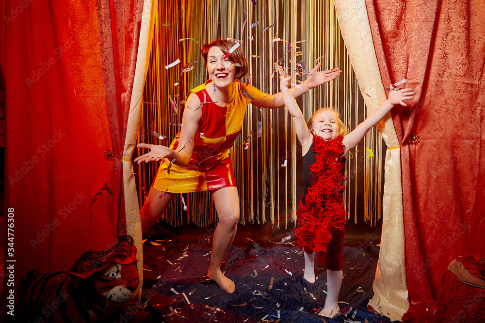Family during a stylized theatrical circus photo shoot in a beautiful ...