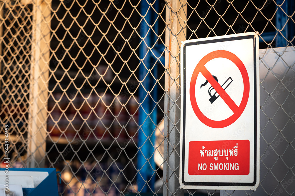 "No smoking" plate sign with Thai work which is located on the Chemical ...