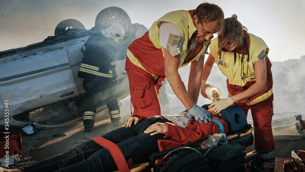 On the Car Crash Traffic Accident Scene: Paramedics Saving Life of a ...