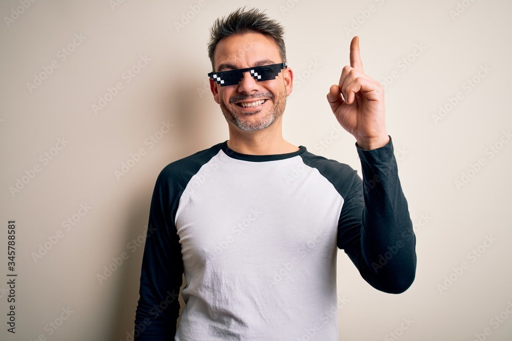 Young handsome man wearing funny thug life sunglasses meme over white ...