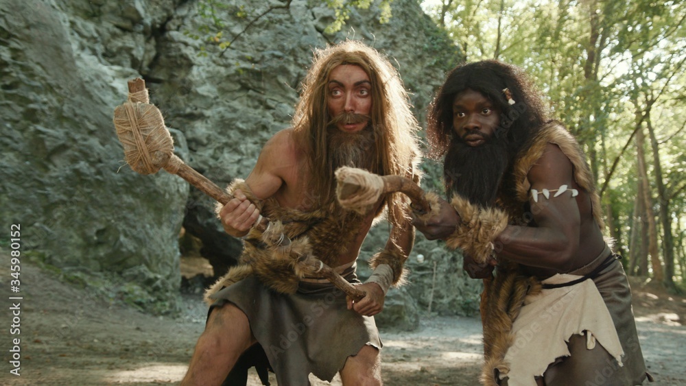 Aboriginal wild caveman of prehistoric period hunting for animal food ...