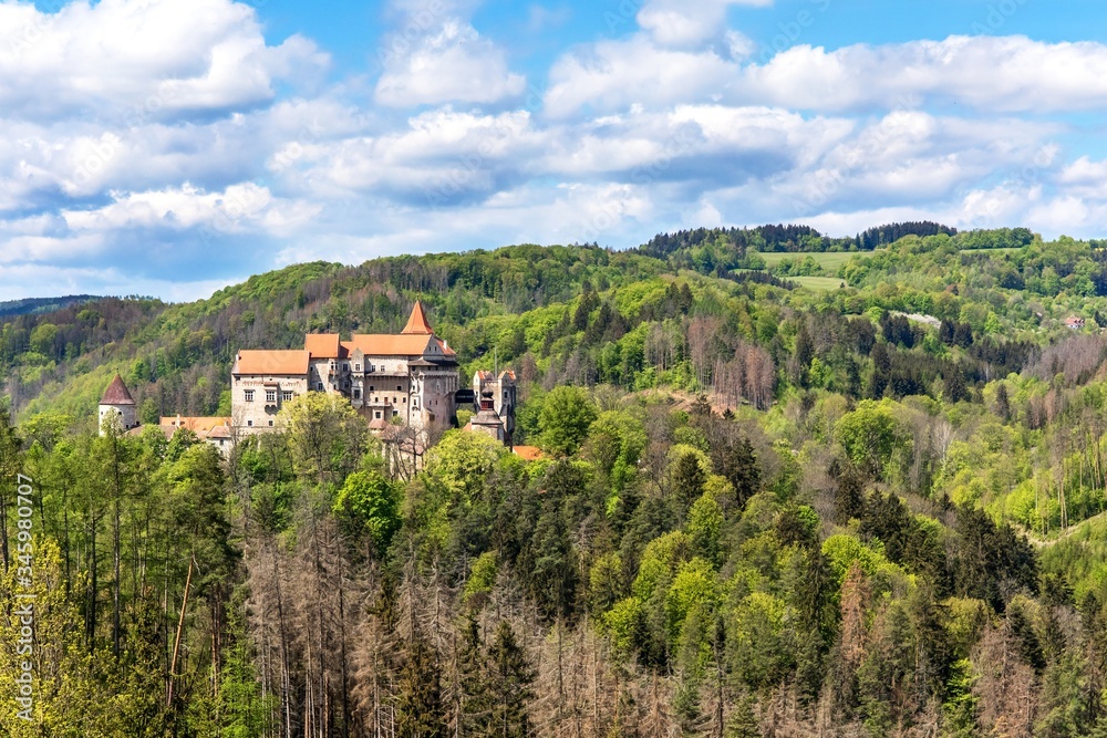 Stock-Foto „Medieval castle of Pernstein on a hill in the forest. Built ...