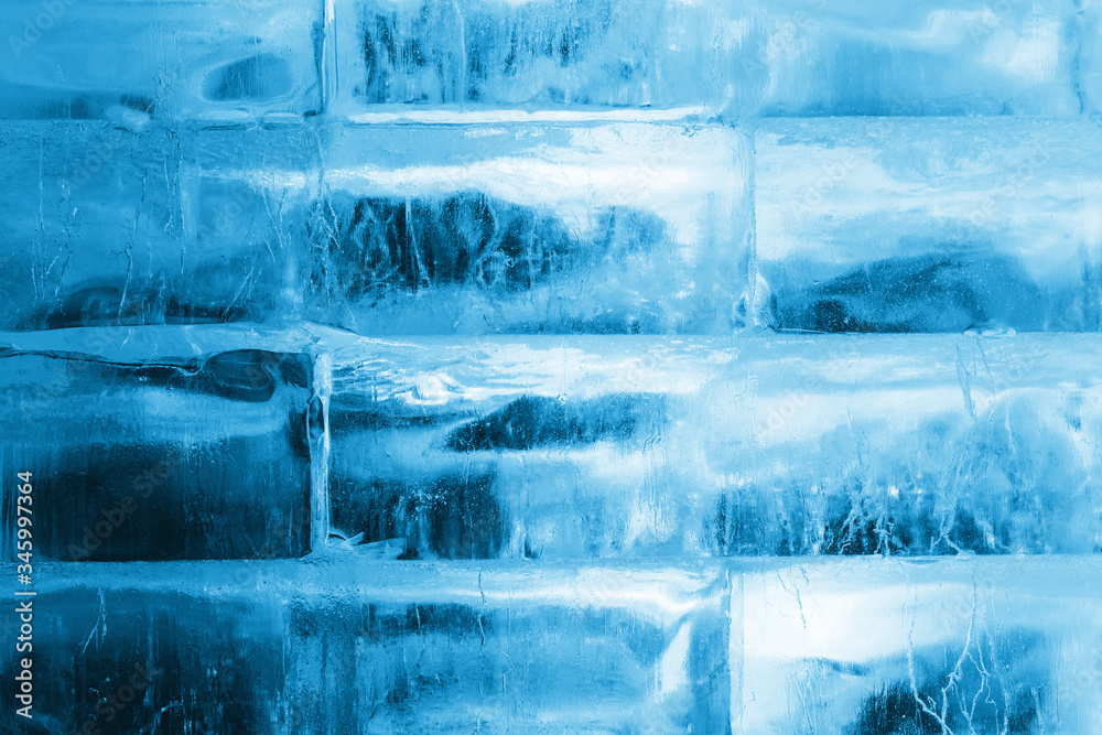 Large pieces of ice made in the form of a brick wall, transparent ...