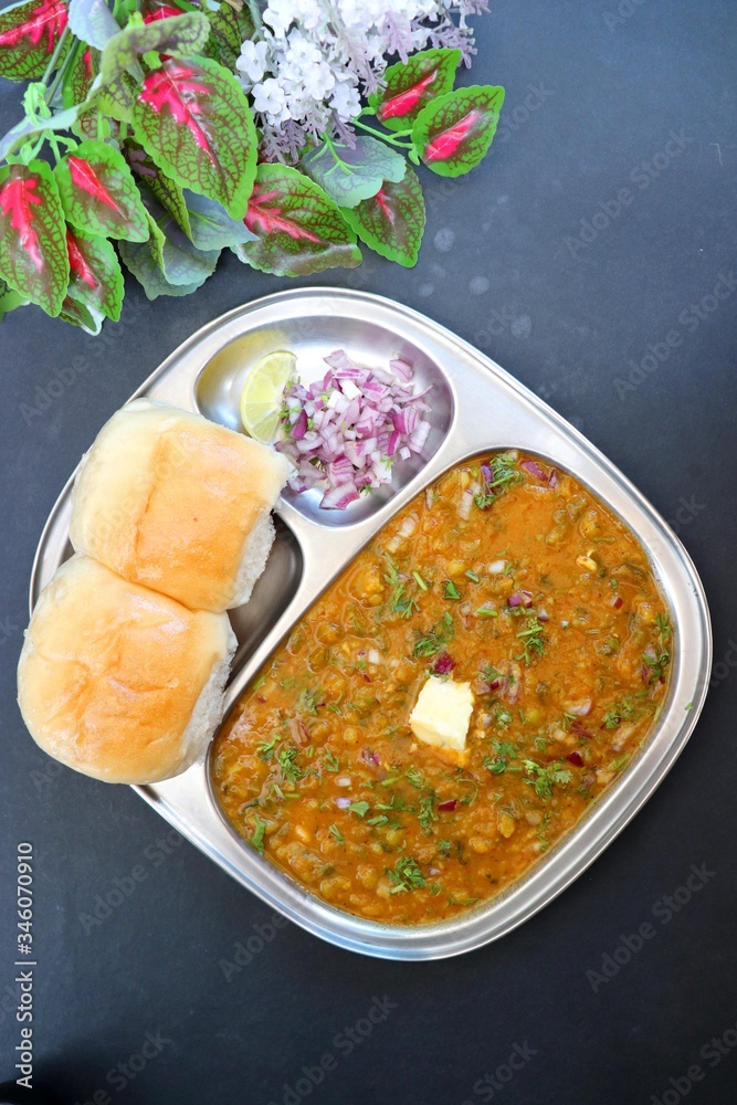 Indian popular past food Pav Bhaji. It is a mixed vegetable curry ...