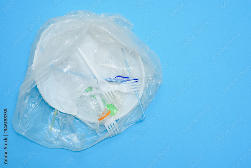 White plastic on a blue background. Plastic pollution. Recycling ...
