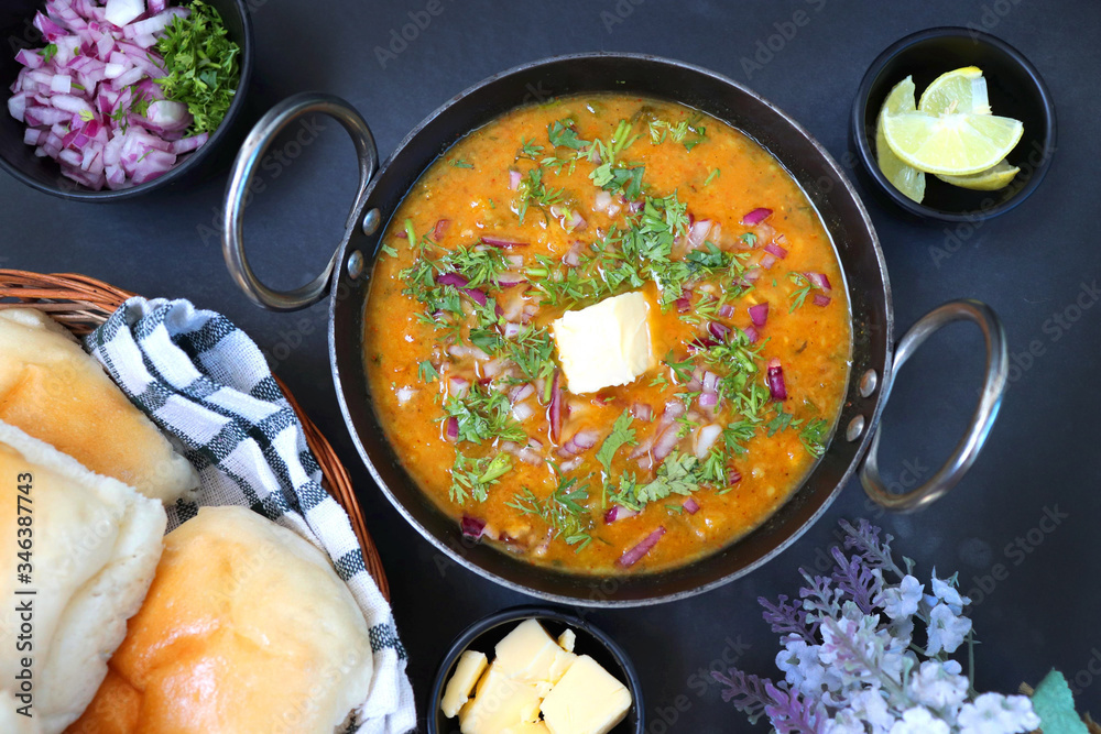 Indian popular fast food Pav Bhaji. It is a mixed vegetable curry ...