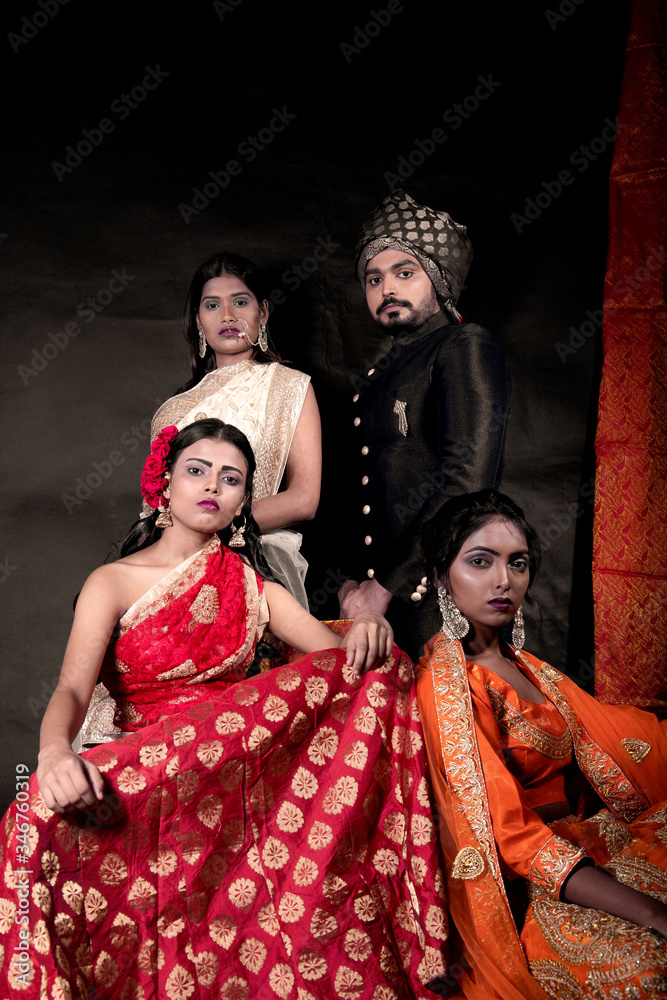 indian models in indian ethnic Saree, Lehenga and male model in a black ...
