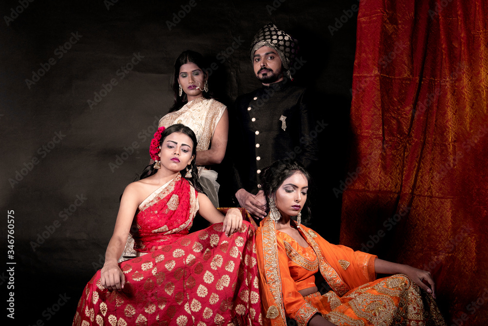 indian models in indian ethnic Saree, Lehenga and male model in a black ...