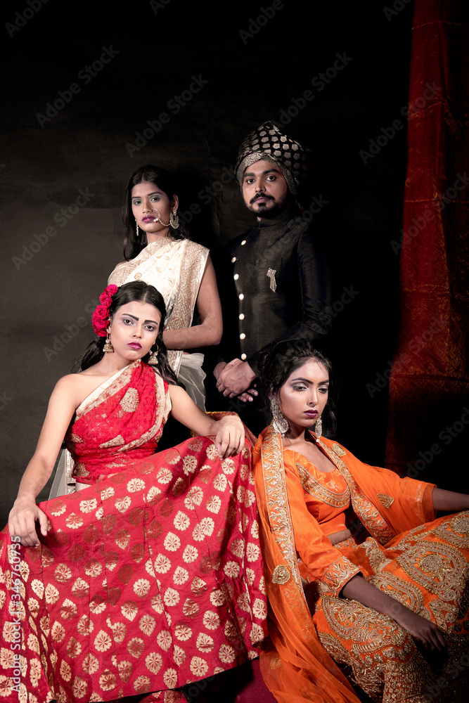 indian models in indian ethnic Saree, Lehenga and male model in a black ...