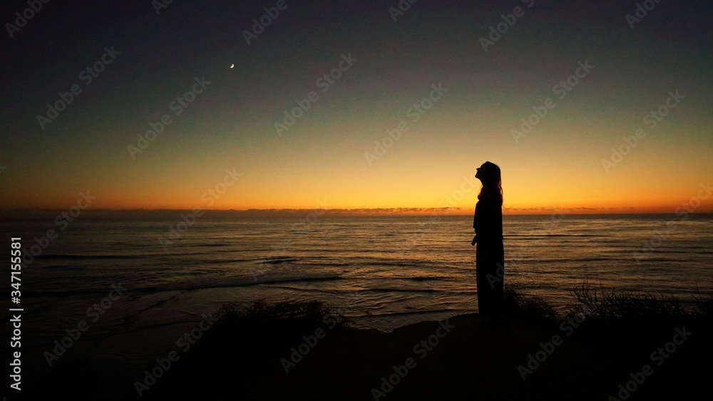 girl watching the sunset at the Sunset Cliffs Natural Park in San Diego ...