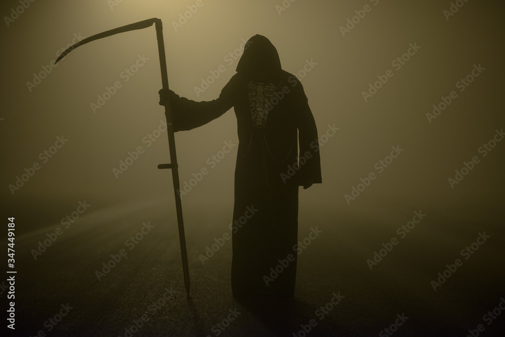 Death grim Reaper skeleton wearing a black robe and wielding a scythe ...