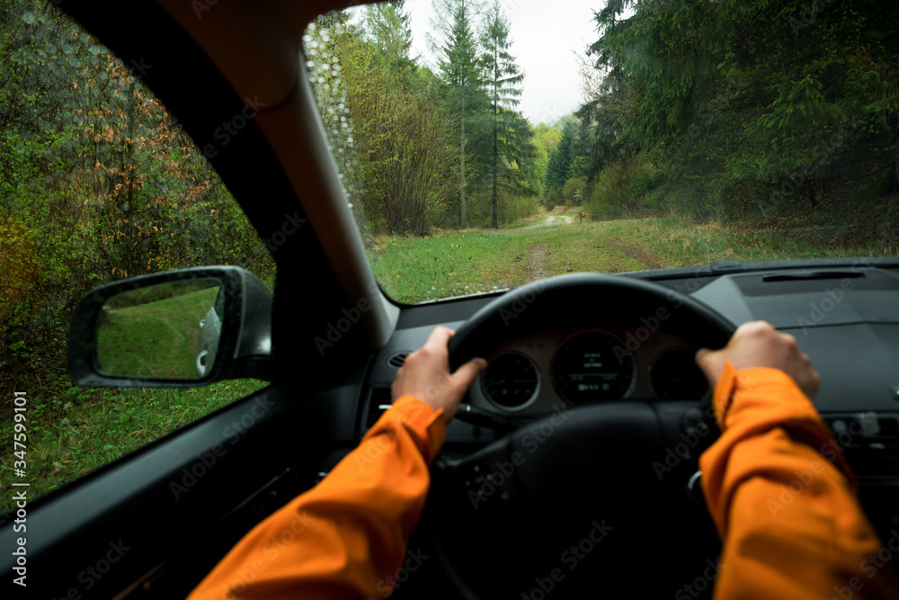 Foto de Stock Driver dressed bright orange jacket driving a modern off ...