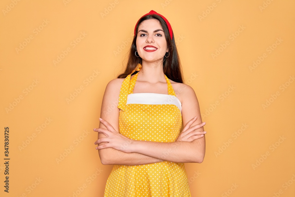 Young beautiful pin up woman wearing 50s fashion vintage dress over ...